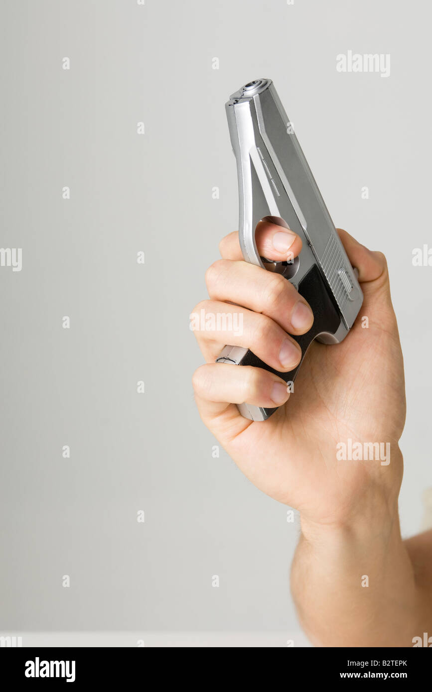 Hand holding gun, close-up Stock Photo - Alamy Hand holding gun, close-up Stock Photo - Alamy