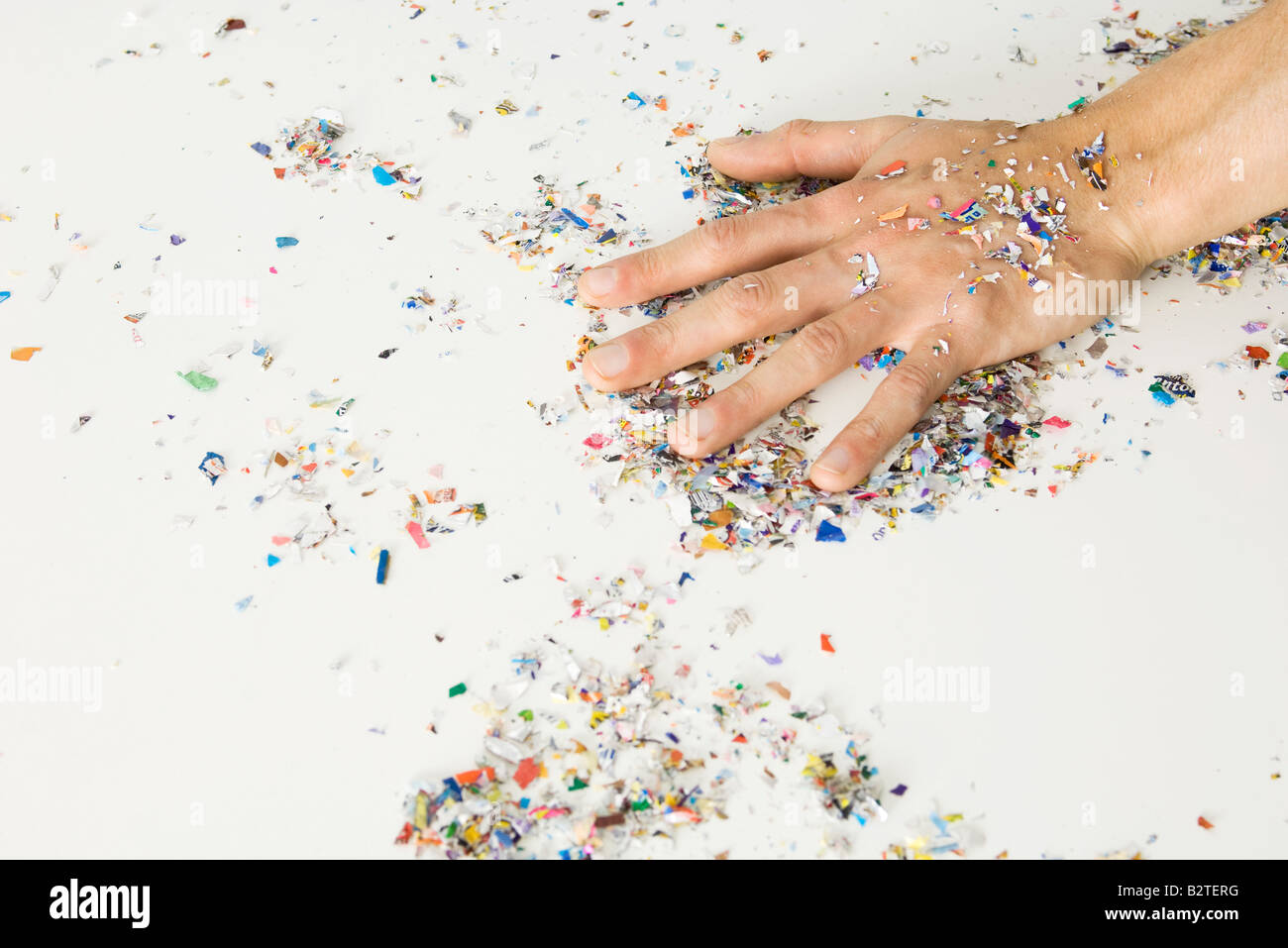 Hand covered with confetti Stock Photo - Alamy