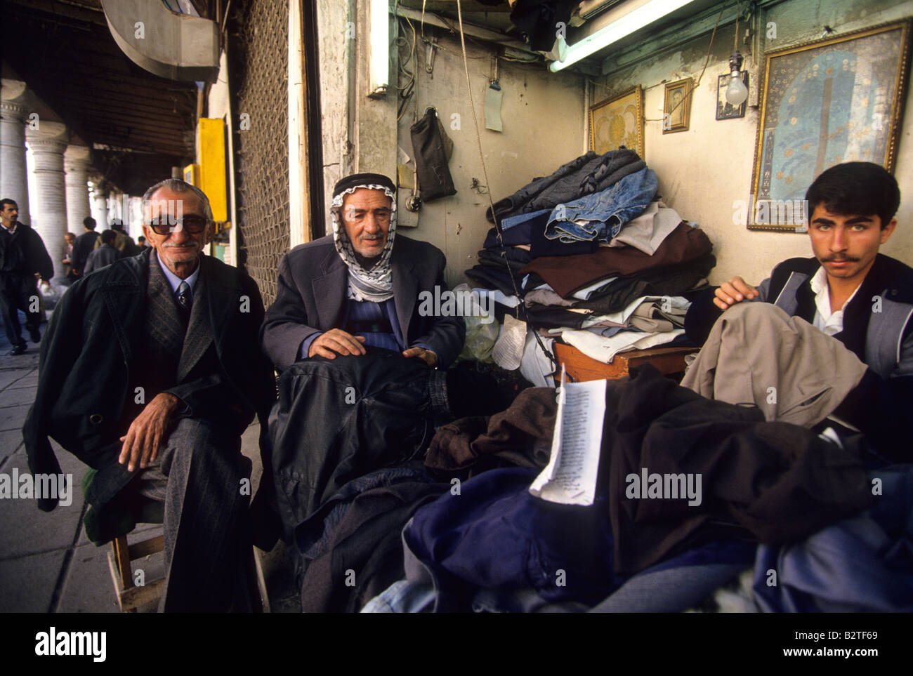 Iraqi men sit around a tailor's shop in Baghdad Iraq Stock Photo - Alamy