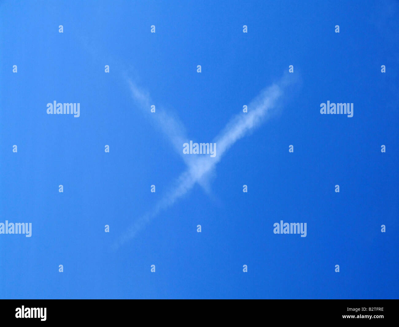 cross shaped clouds in blue sky in sun outdoors Stock Photo - Alamy