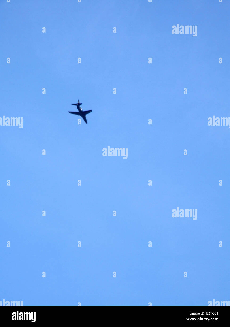 one private type jet plane flying in blue sky Stock Photo - Alamy