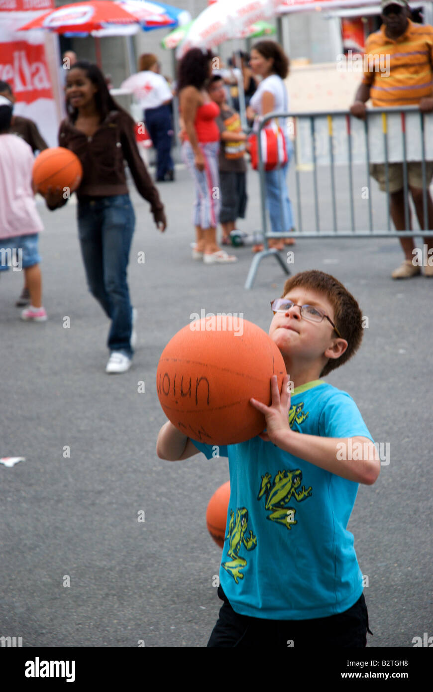 Young boy shooting baskets Stock Photo - Alamy