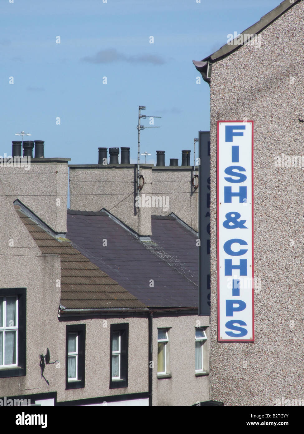 fish and chips shop sign in holyhead wales Stock Photo - Alamy