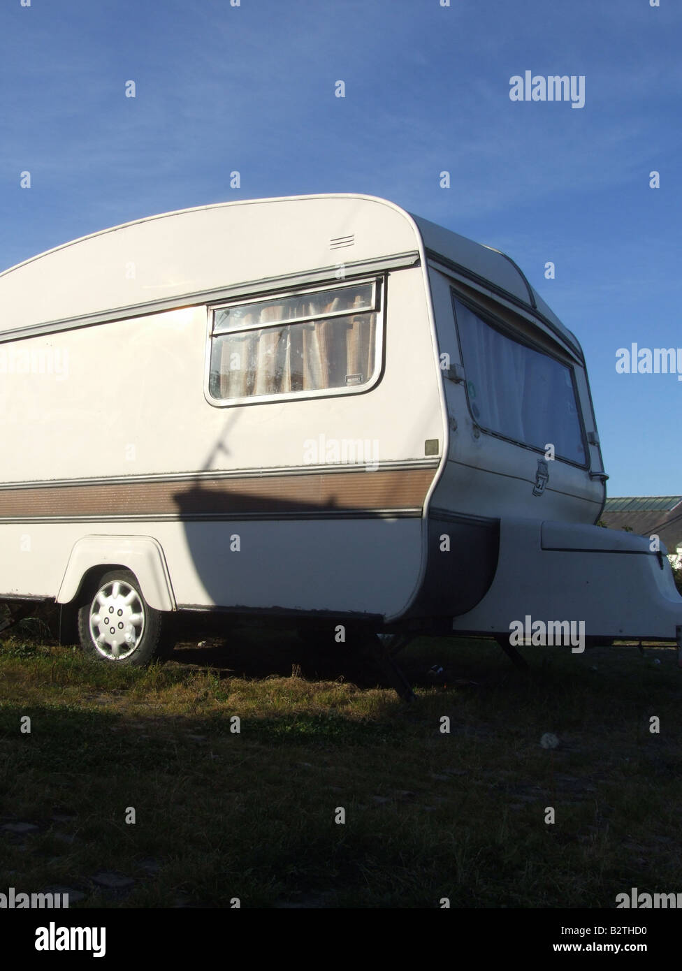 one small white caravan outdoors Stock Photo - Alamy