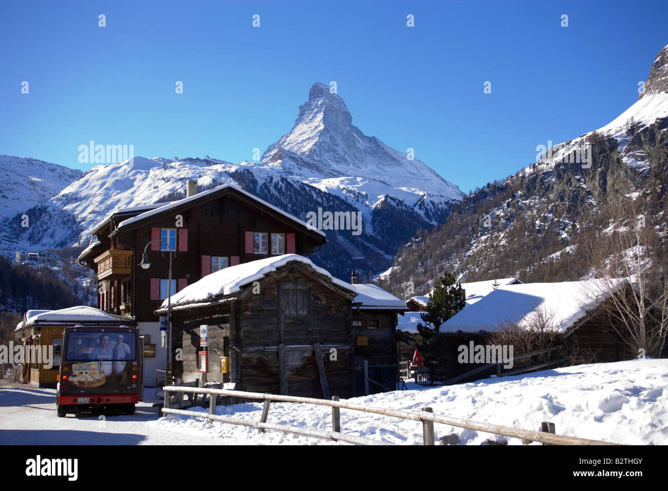 Bus at bus stop, Zermatt village with the Matterhorn (4478 metres) in ...