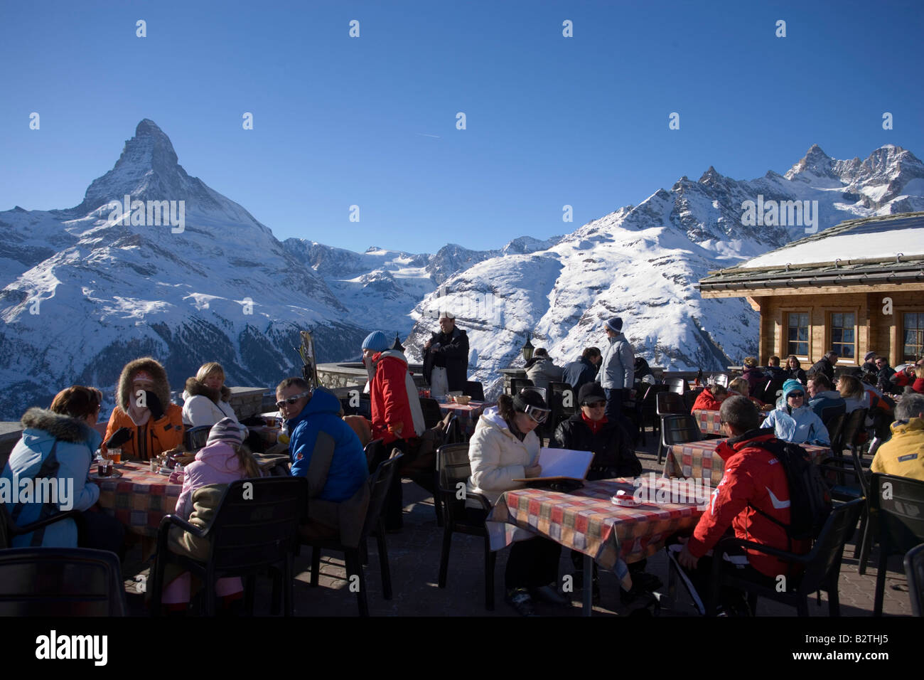 People sitting on the terrace of the Restaurant Blauherd with a view to ...