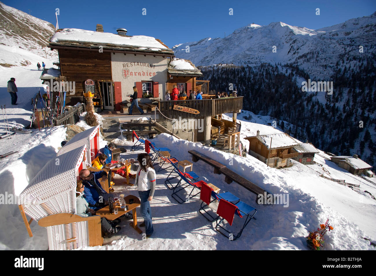 People sitting on terrace of Restaurant Paradies (2540 m), Findeln ...
