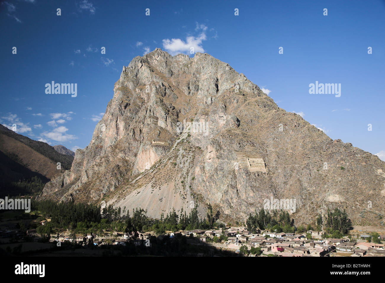 The mountain towers over the town of Ollantaytambo, site of huge Inca ...