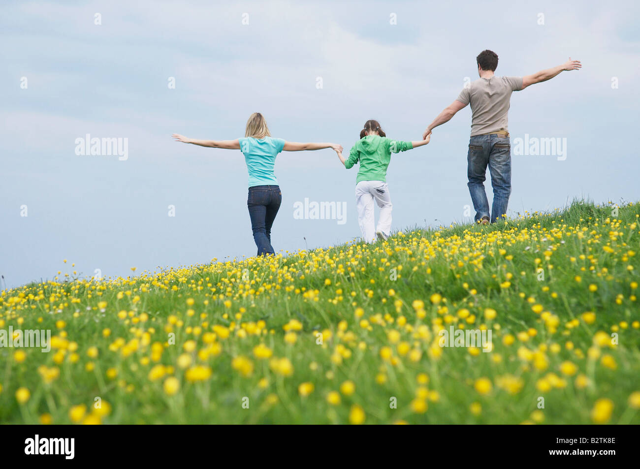 Family walk in field Stock Photo - Alamy