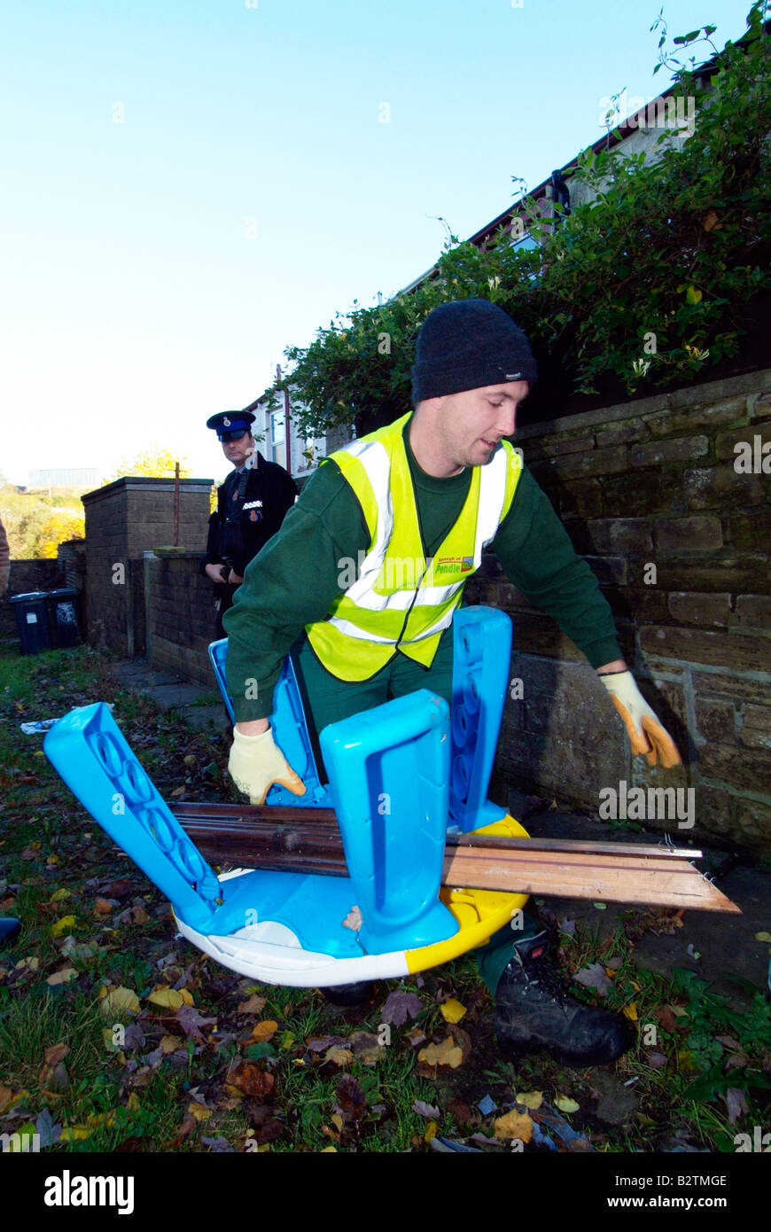 Man collecting rubbish from back streets Stock Photo - Alamy