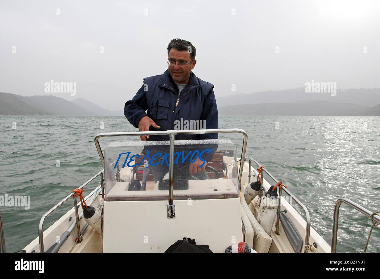 Greece Macedonia Prespa lakes Lake Megali Pespa a boat man Stock Photo ...