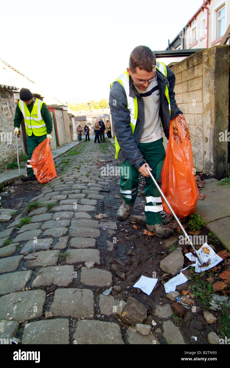 Men collecting rubbish from back streets Stock Photo - Alamy