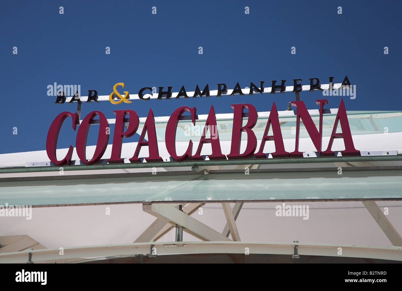 A close-up view of a sign for a Champagne Bar ituated on Copacabana ...