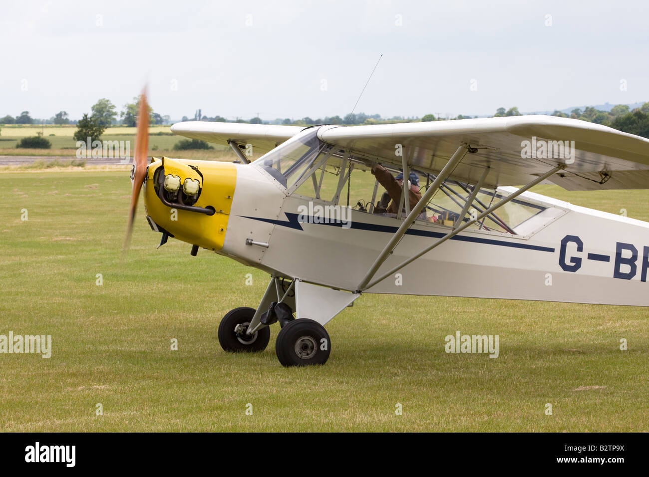 Piper J3-C-65 Cub G-BROR taxiing at Wickenby Airfield Stock Photo - Alamy