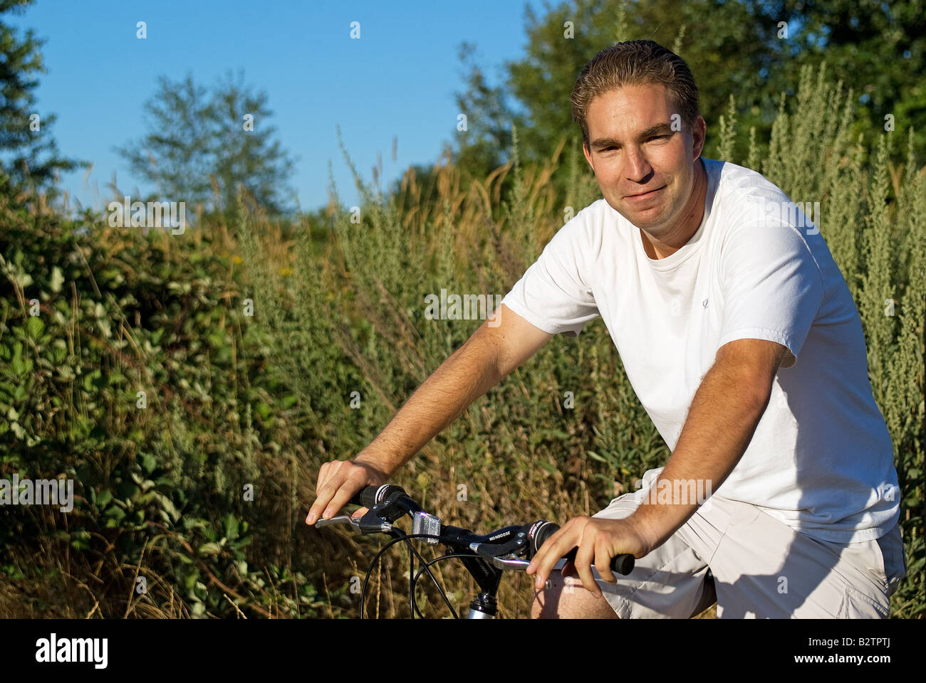 Man on Bicycle Stock Photo - Alamy
