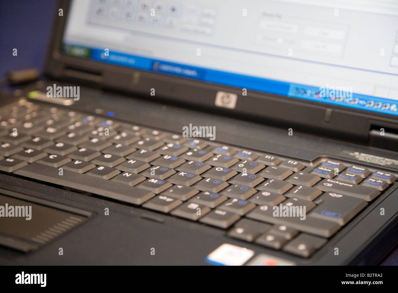 A laptop computer keyboard and part of its screen Stock Photo - Alamy