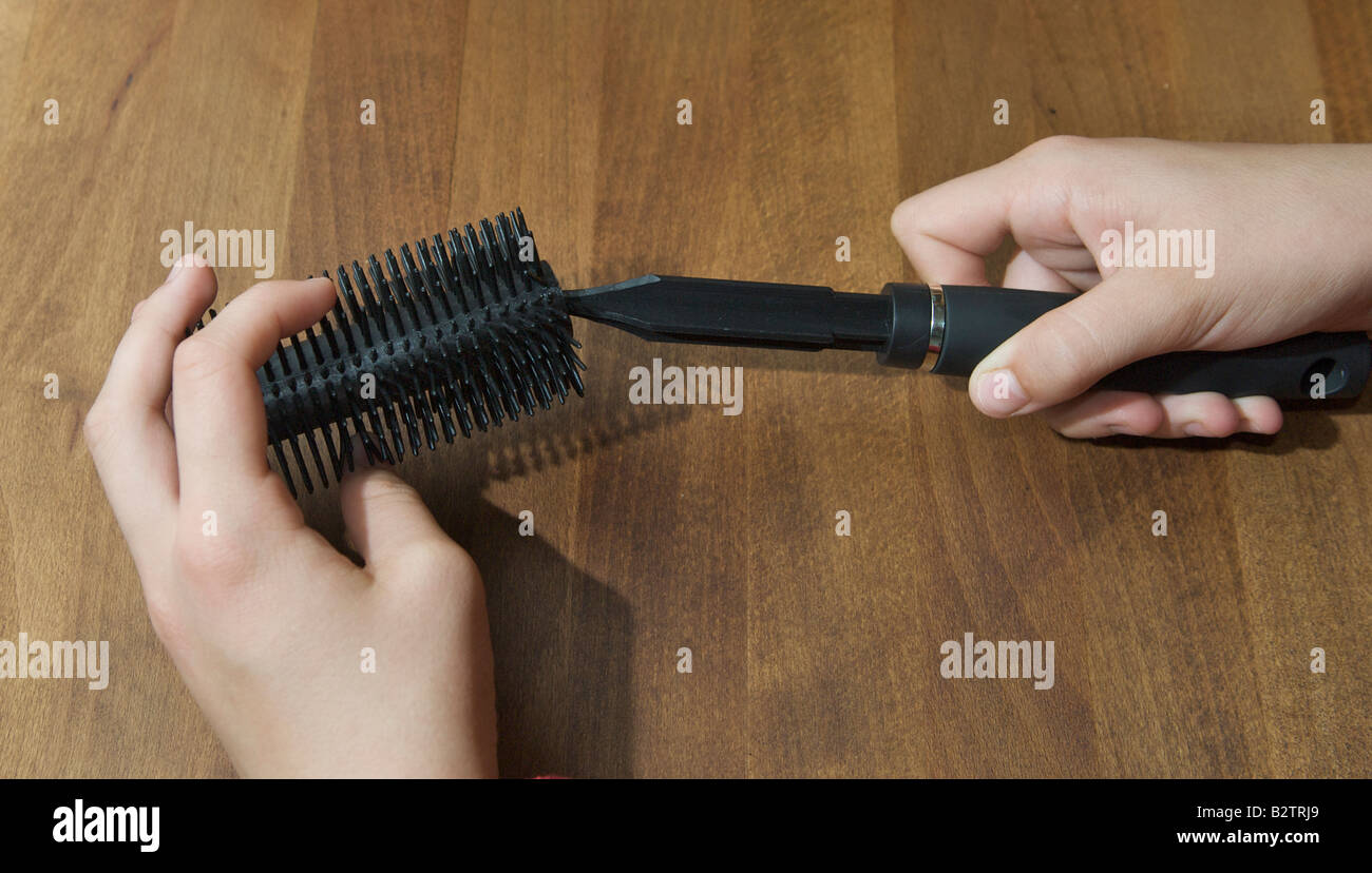 HAIRBRUSH adapted as a weapon Stock Photo - Alamy