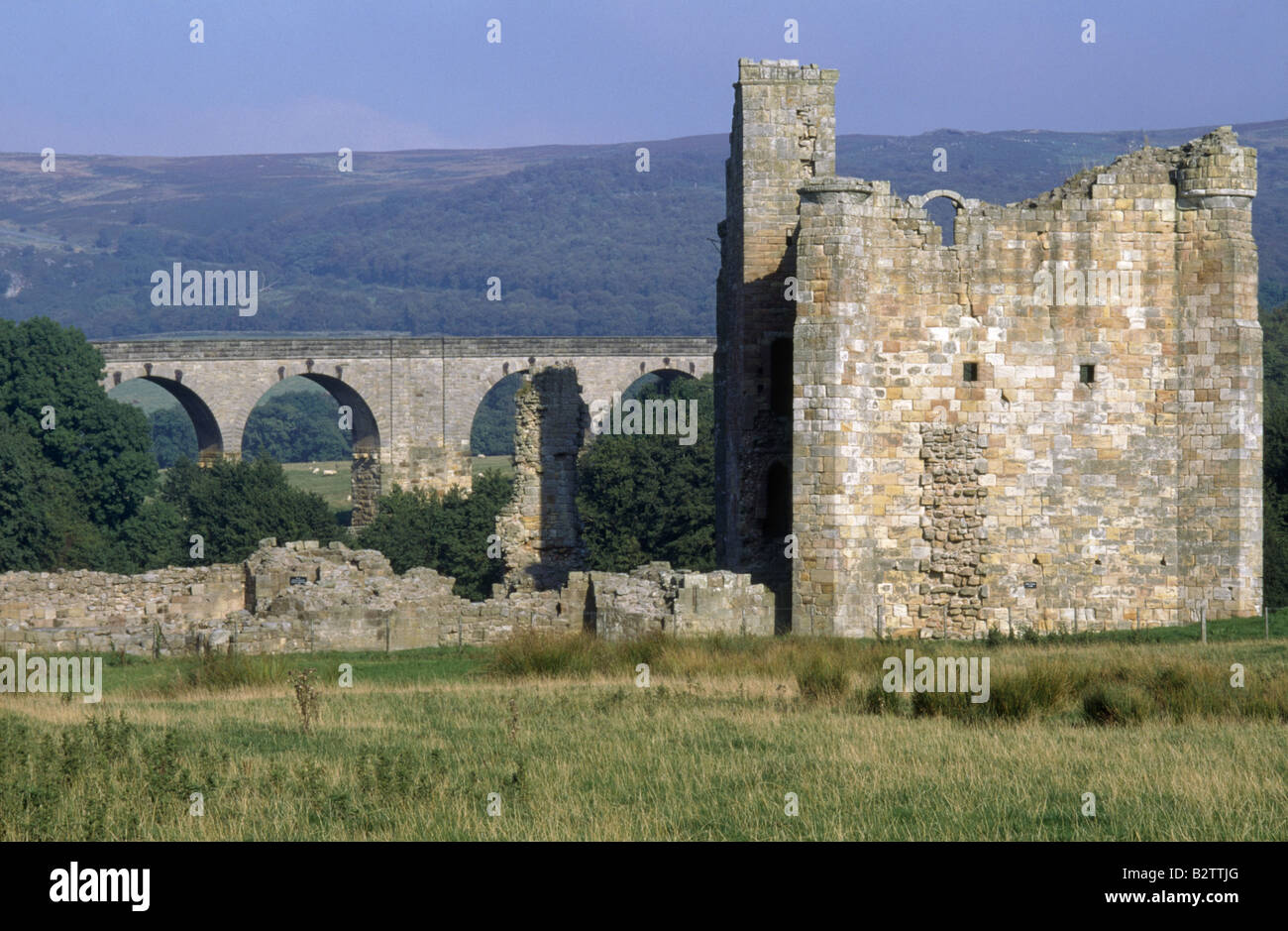 North sea coast Ruins of castle Tall square stone keep Viaduct bridge ...