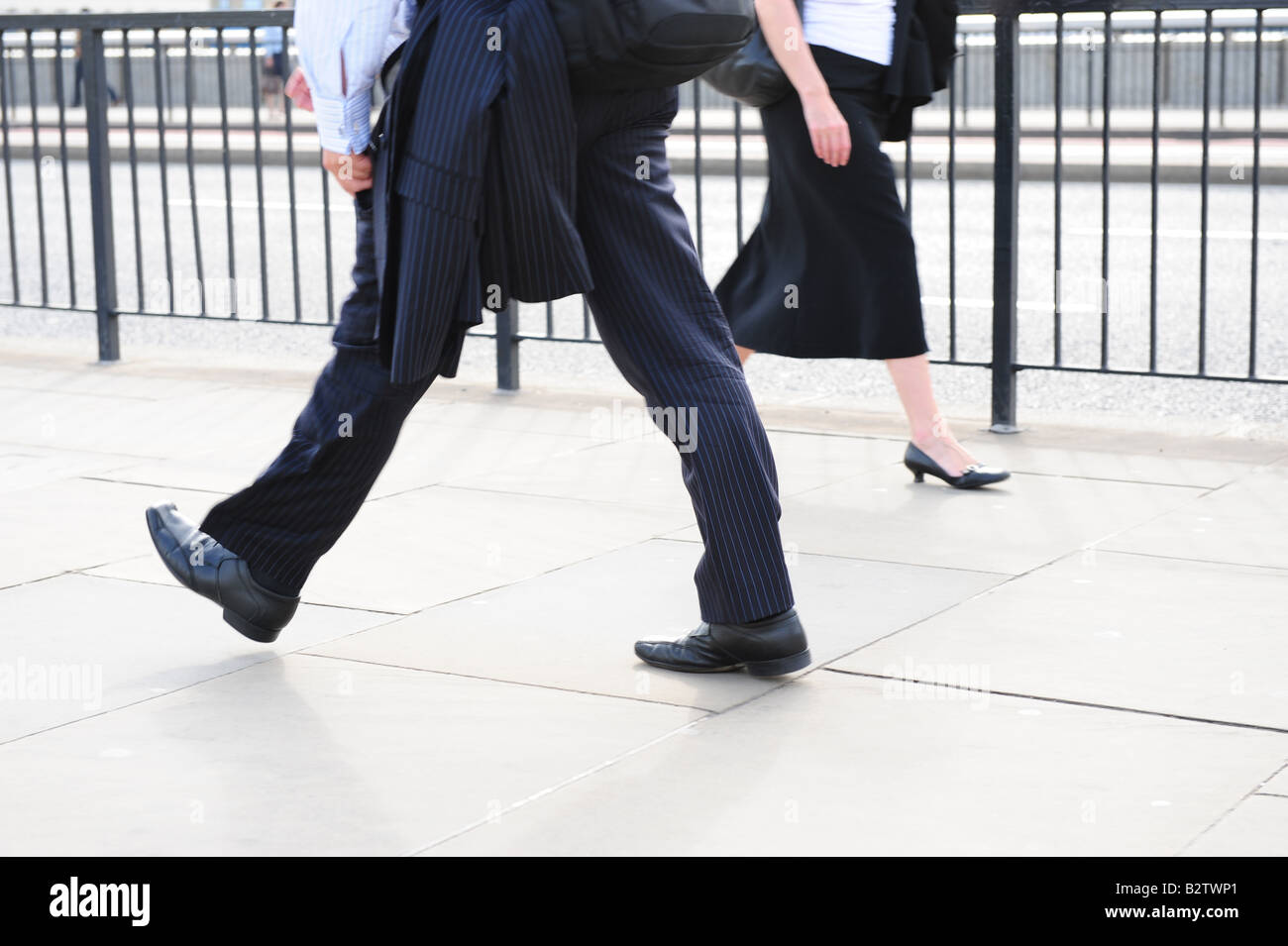 White collar action stepping striding business travel rush hour ...