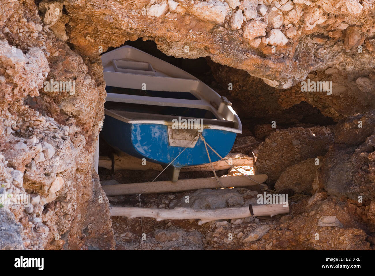 A small blue rowing boat is hidden from sight in a cave on the Peljesac ...
