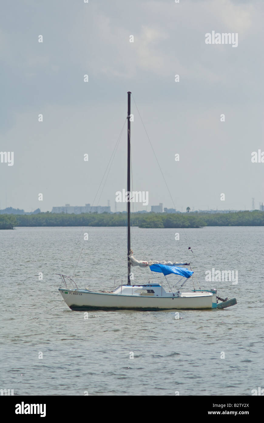 An empty sailboat anchored in the waters off Safety Harbor pier Stock ...