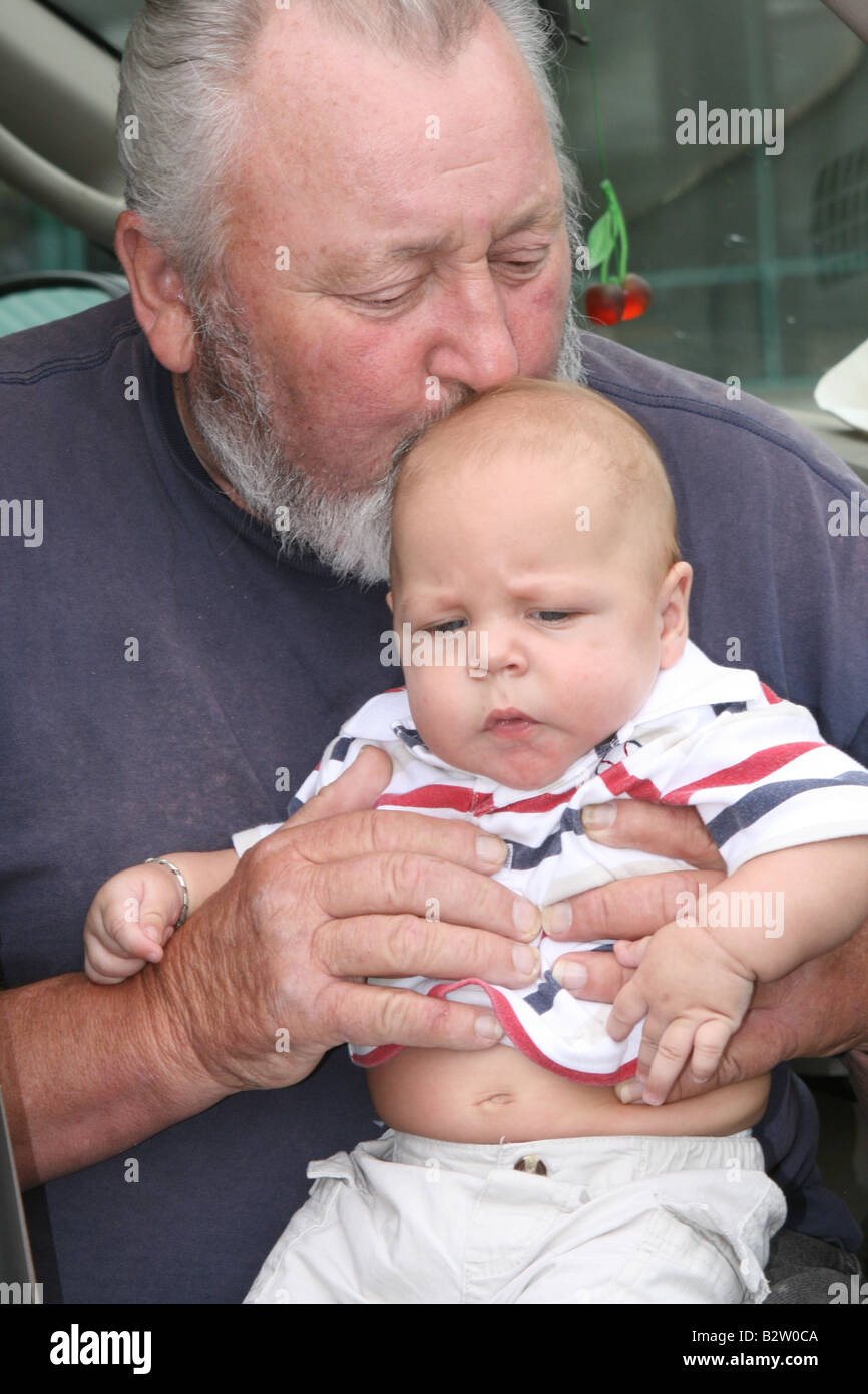 Grandfather with great grandchild Stock Photo - Alamy