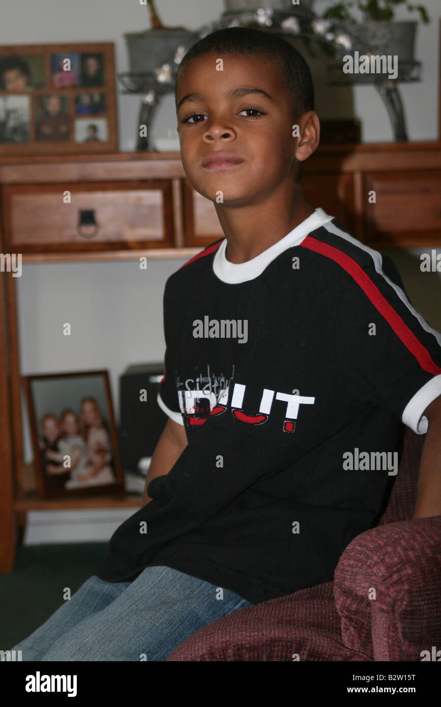 african american,mixed race boy sitting in house Stock Photo - Alamy