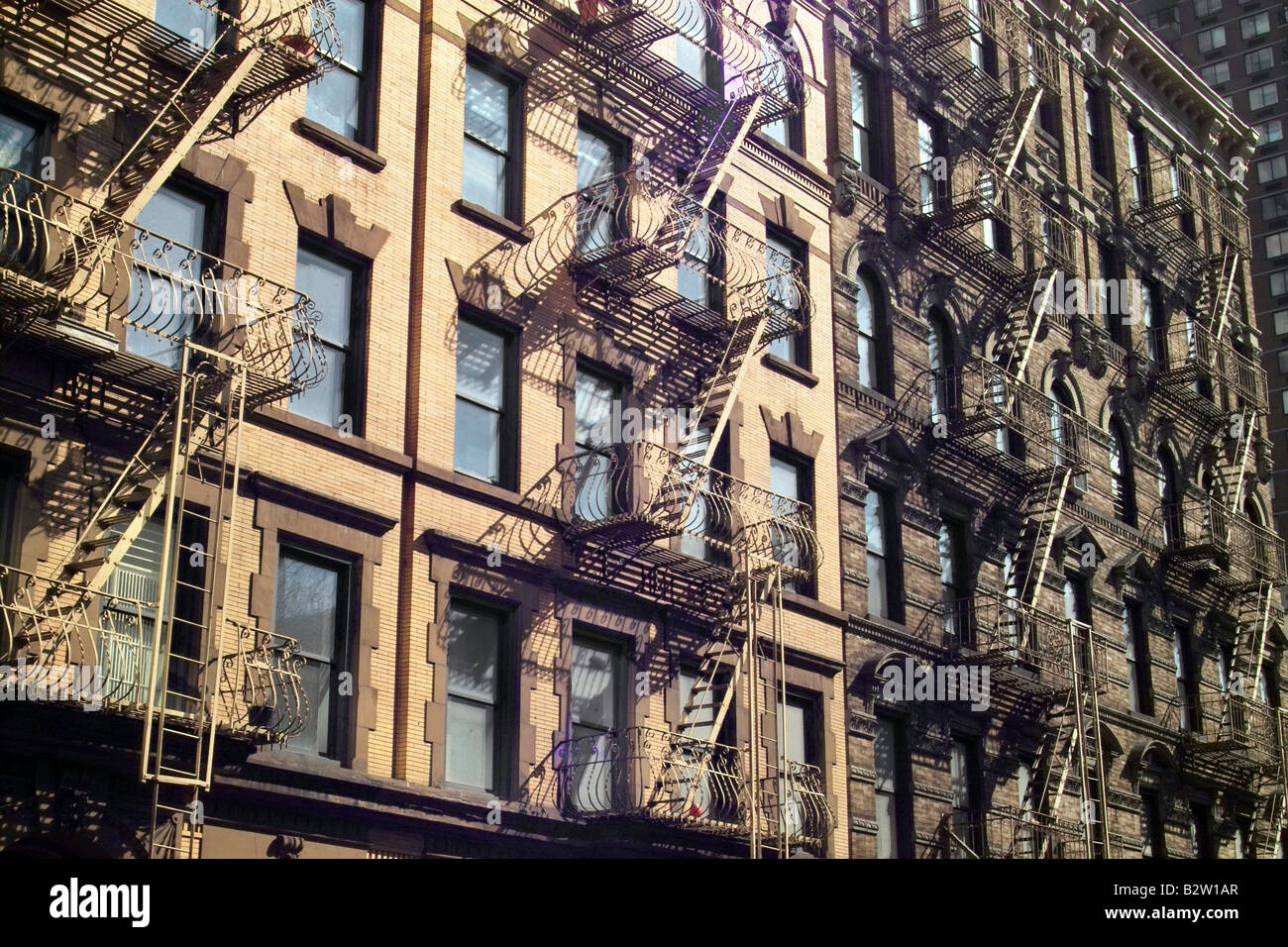 fire escapes on New York apartment block Stock Photo - Alamy