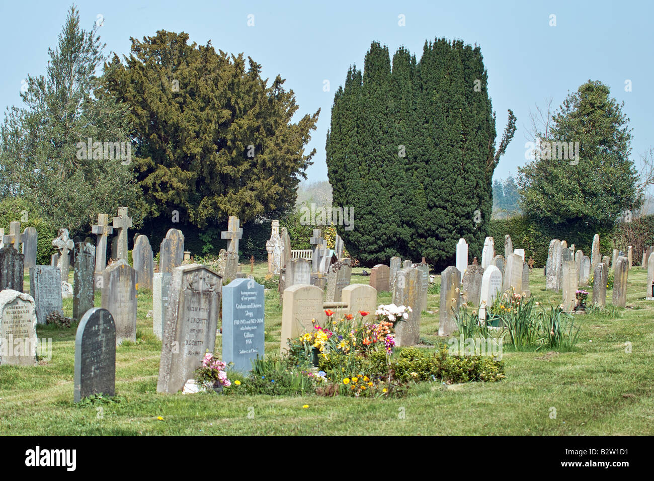 Country grave yard with flowers Stock Photo - Alamy