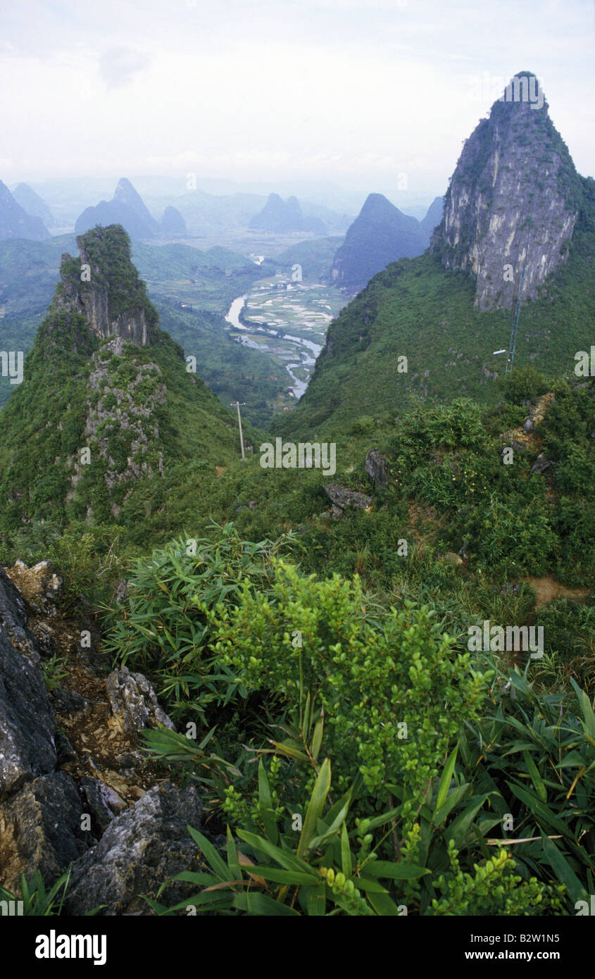 Dramatic limestone pinnacles karsts seen from Crescent Moon Hill Paddy ...