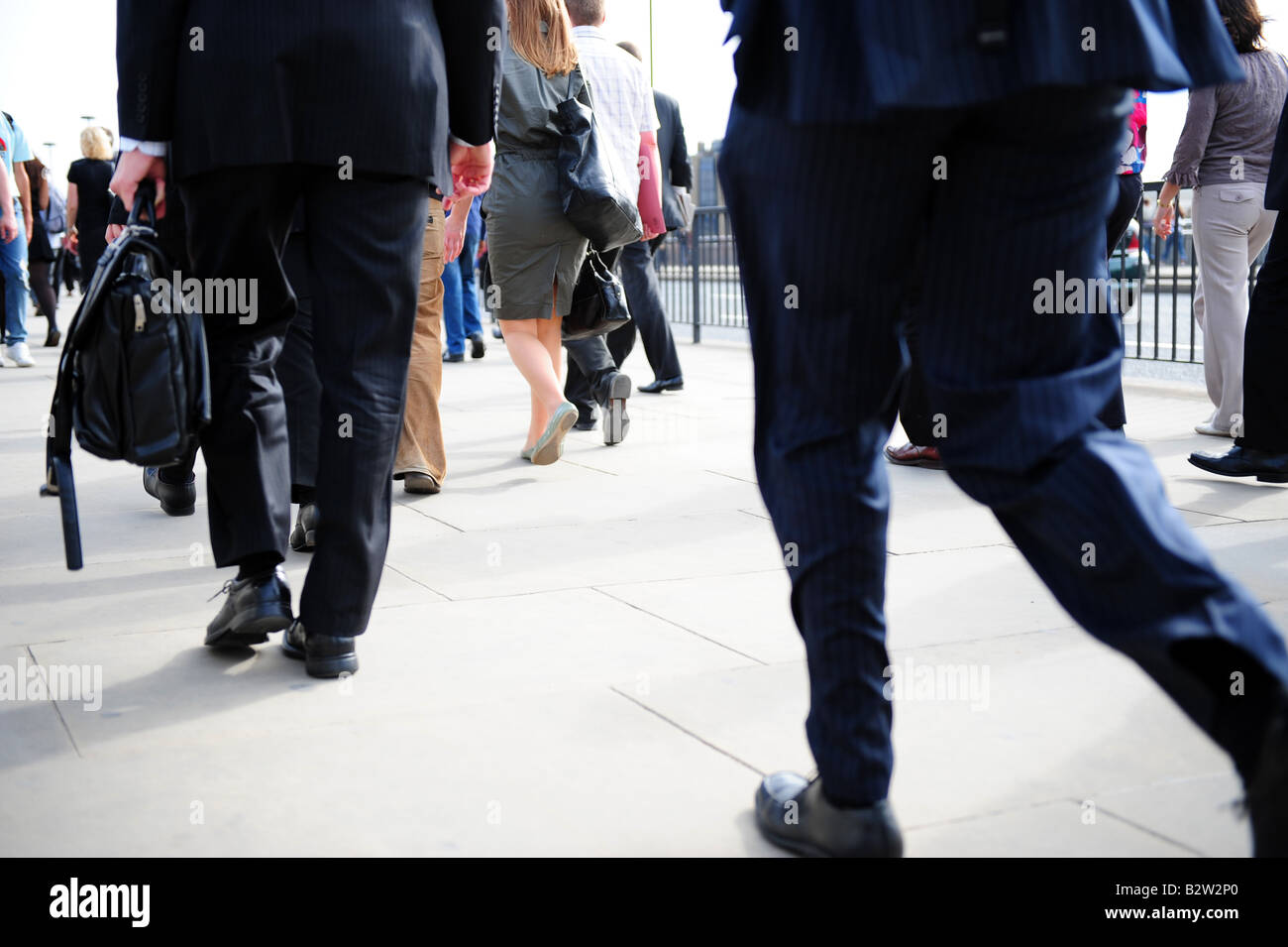 commuters walking over London bridge on their way to work during the ...
