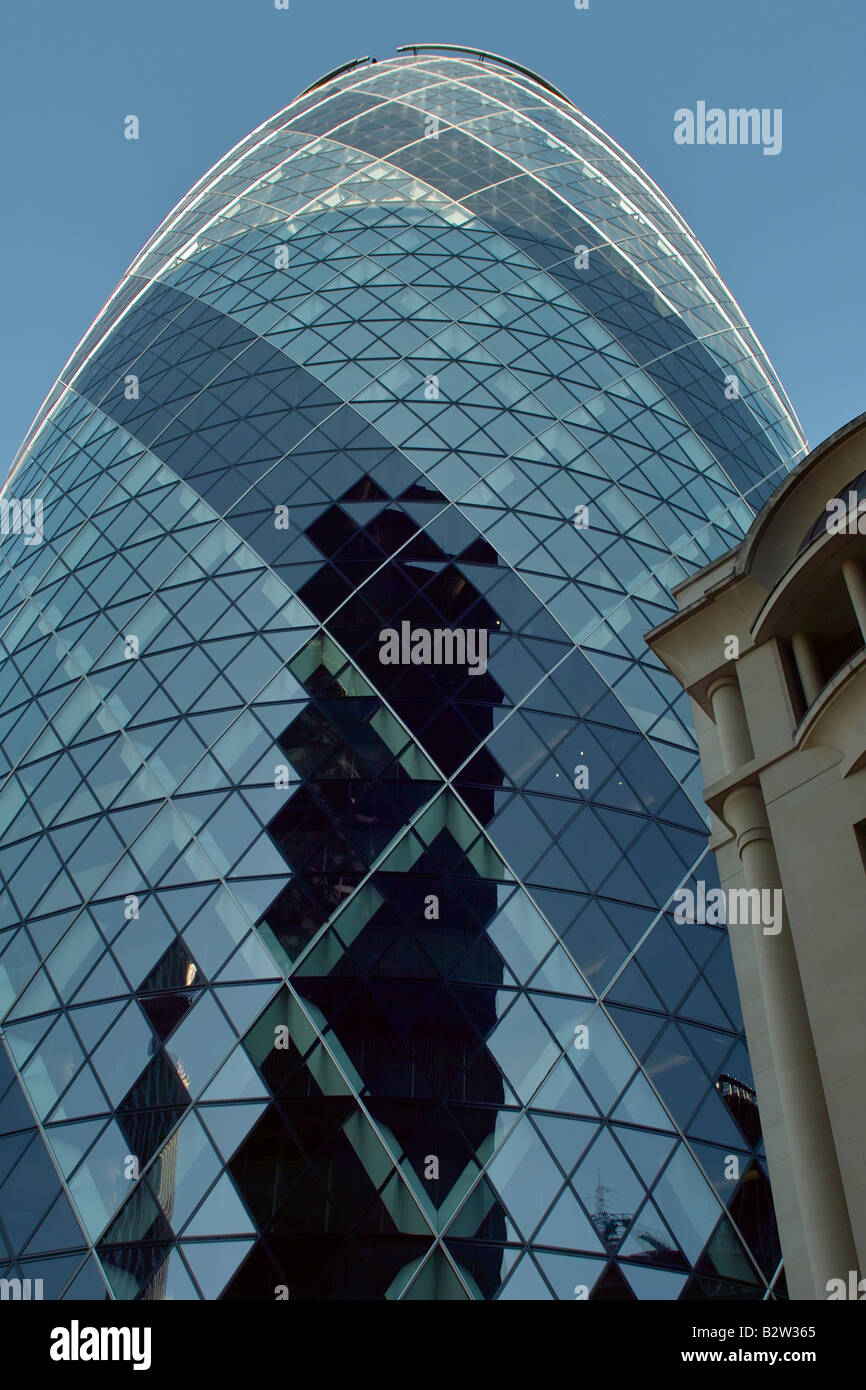 London Gherkin reflecting building opposite Stock Photo - Alamy