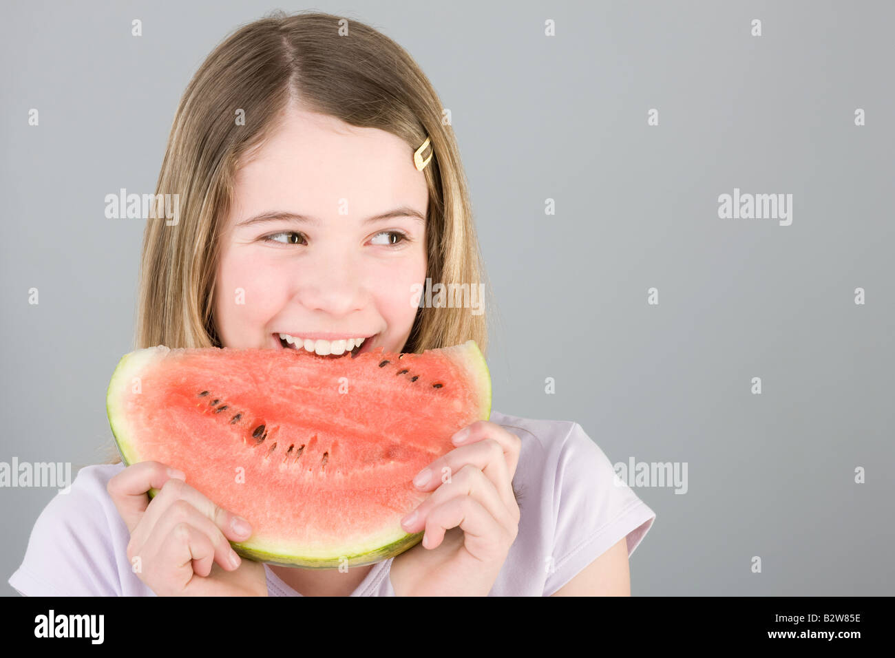 Girl with slice of watermelon Stock Photo - Alamy