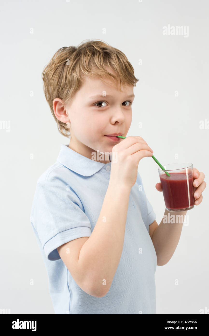 Boy drinking smoothie Stock Photo - Alamy