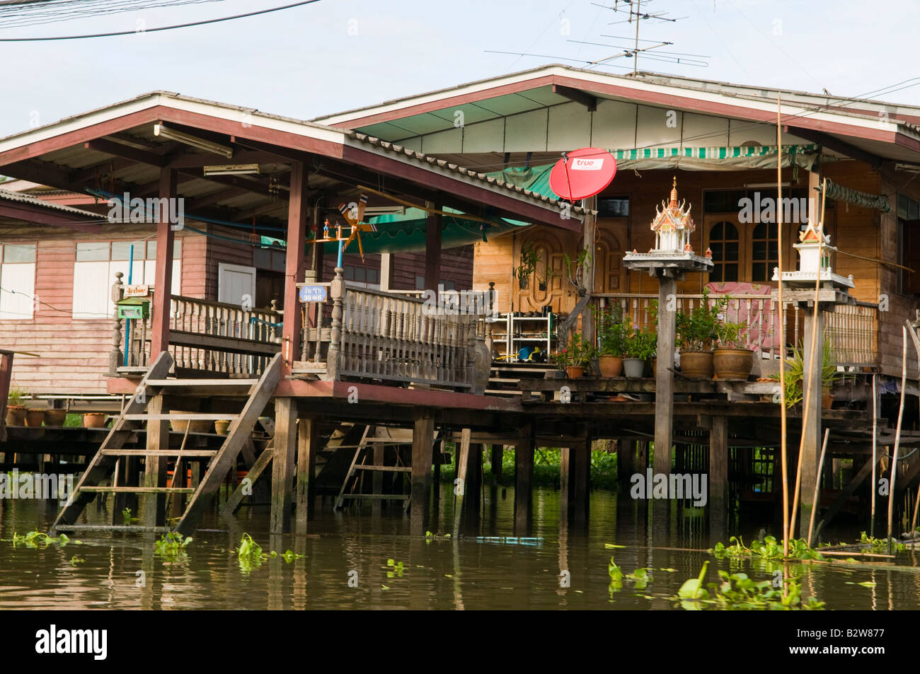 Traditional wooden Thai houses on stilts in Bangkok Stock Photo - Alamy