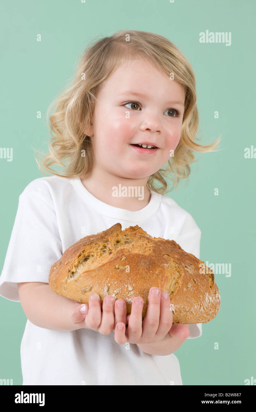 Girl with loaf of bread Stock Photo - Alamy