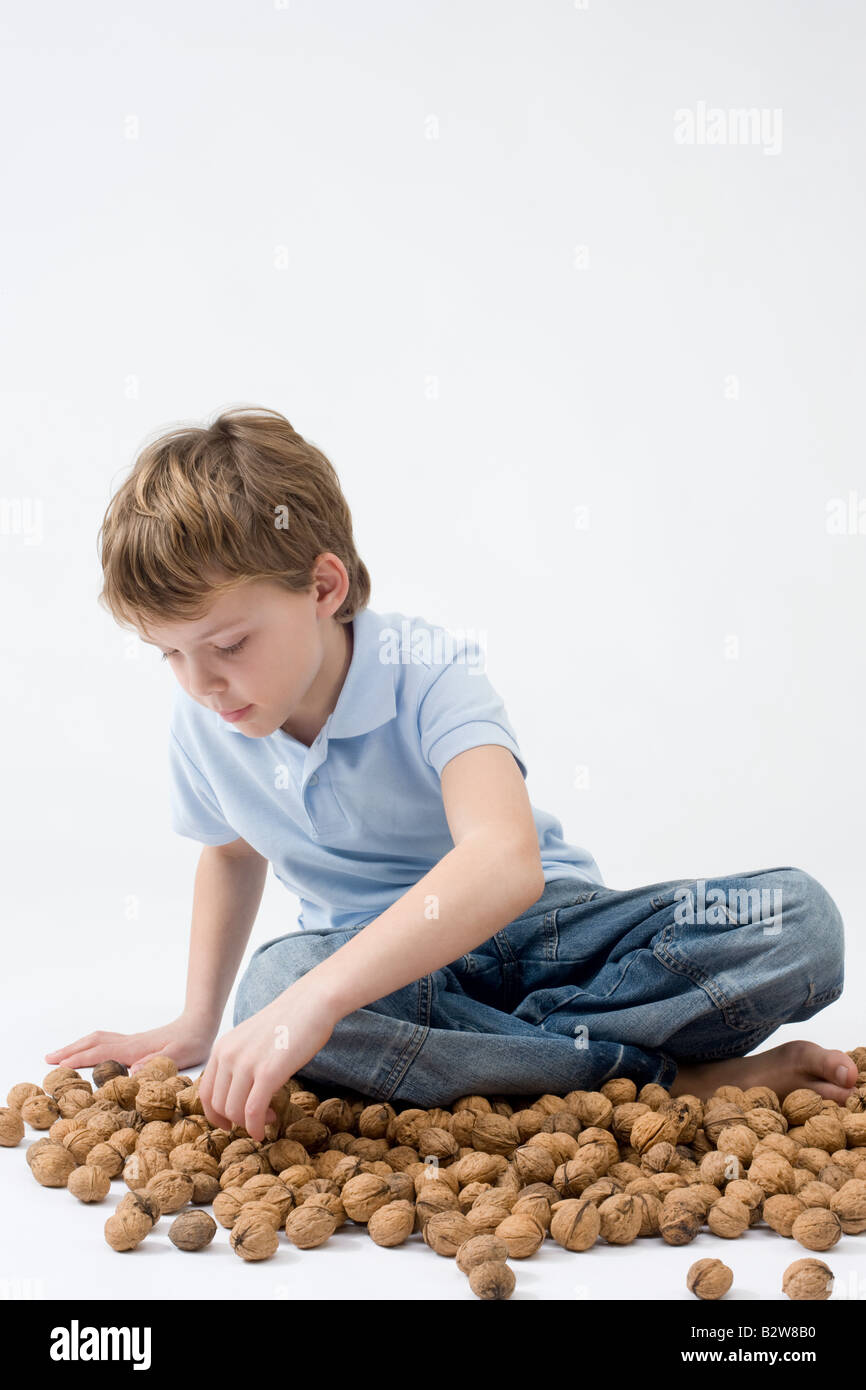 Boy with walnuts Stock Photo - Alamy