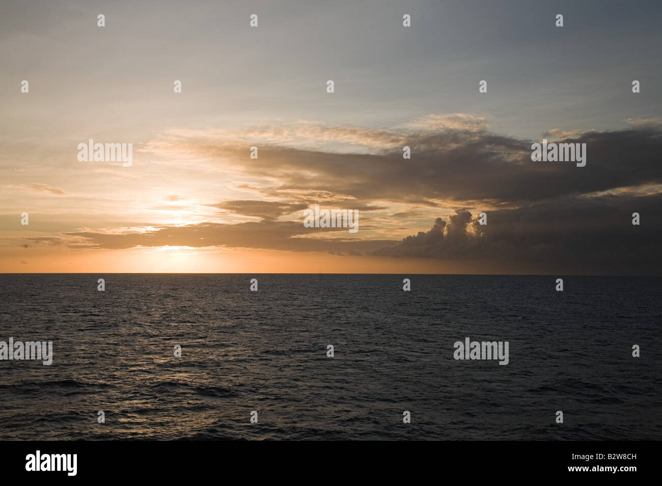 Sunset over the ocean Stock Photo - Alamy