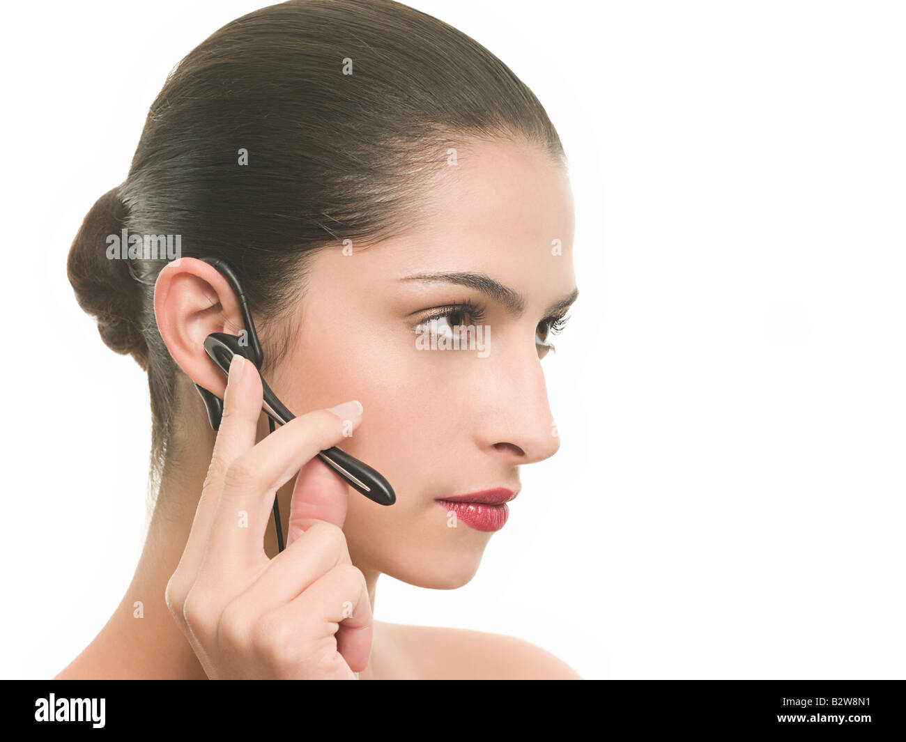Woman using hands free device Stock Photo - Alamy