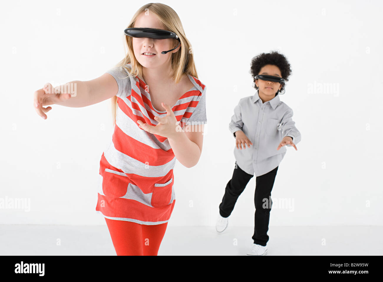 Kids wearing virtual reality headsets Stock Photo - Alamy