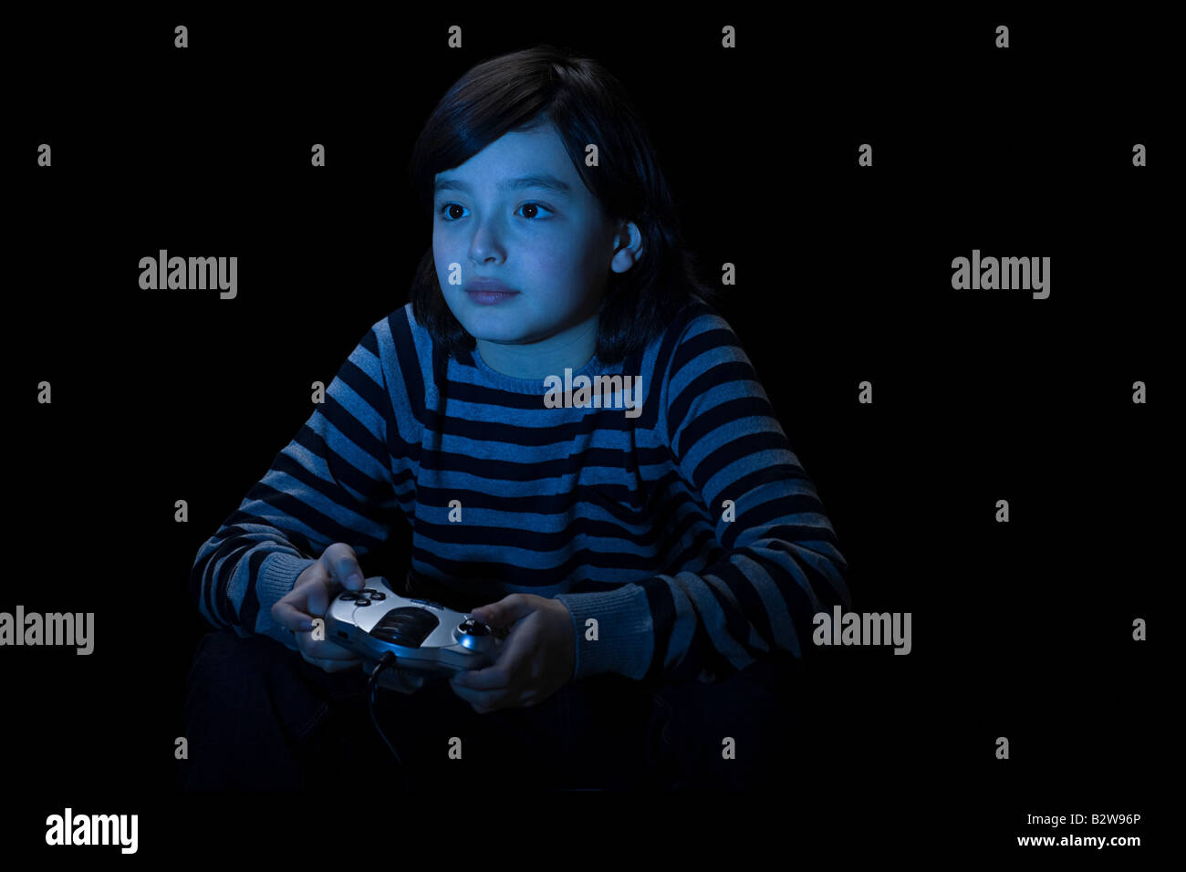 Boy playing video game Stock Photo - Alamy