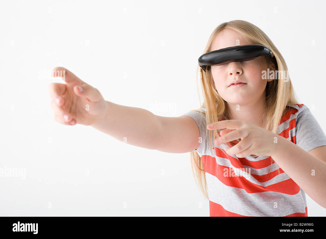 Girl wearing virtual reality headset Stock Photo - Alamy