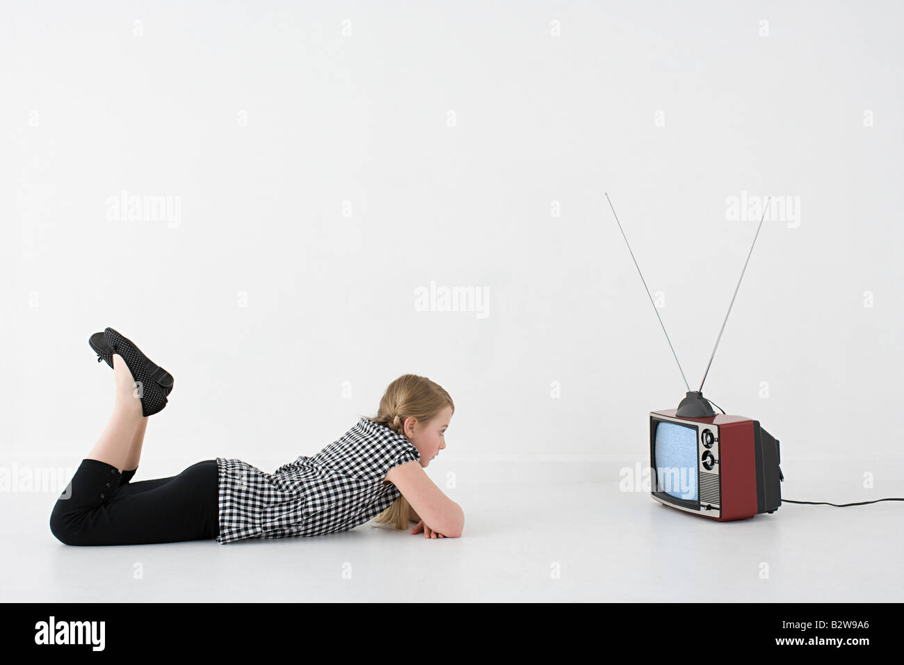 Girl watching television Stock Photo - Alamy