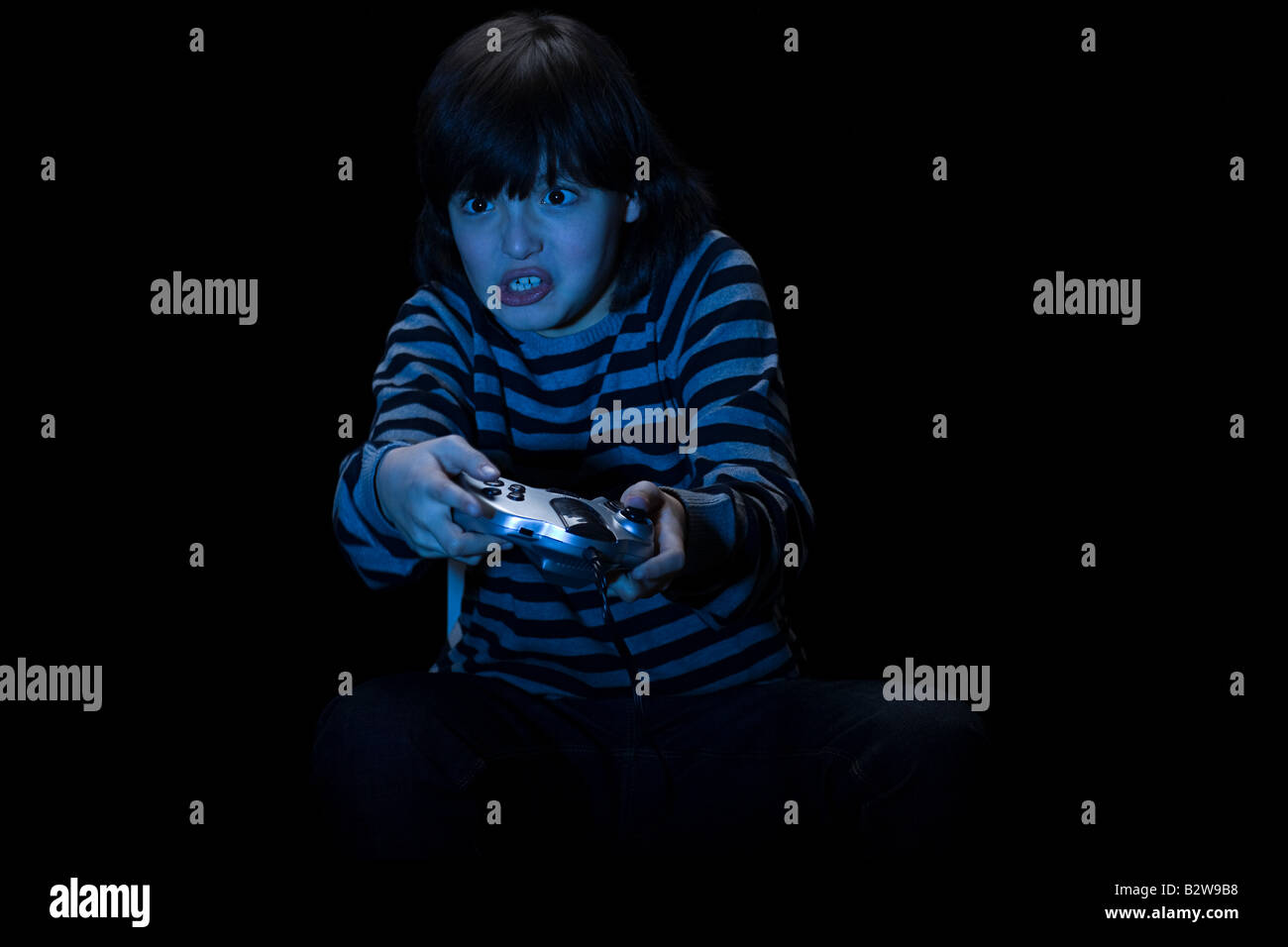 Boy playing video game Stock Photo - Alamy