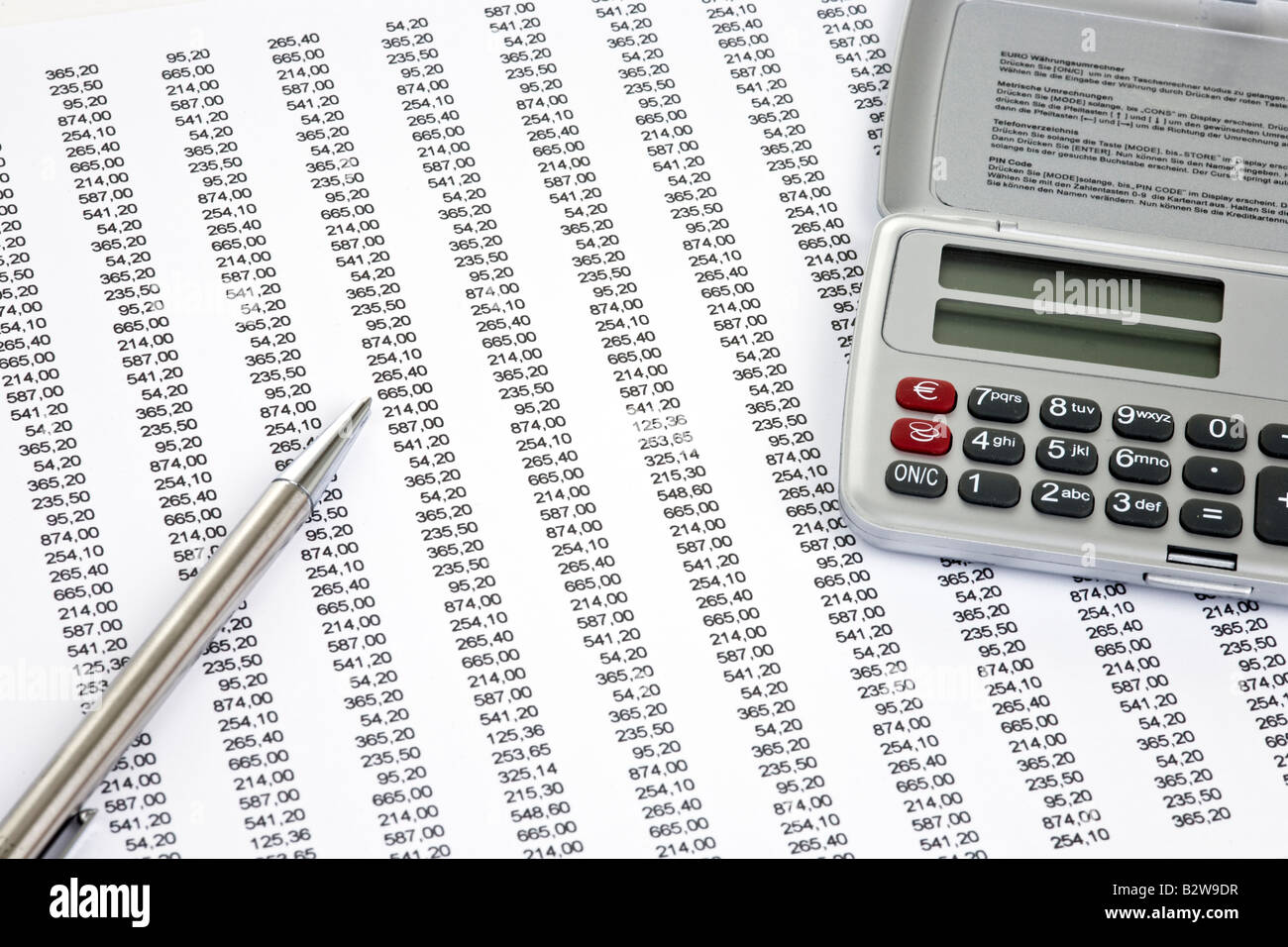 Numerical data with calculator und ball pen - white background Stock ...