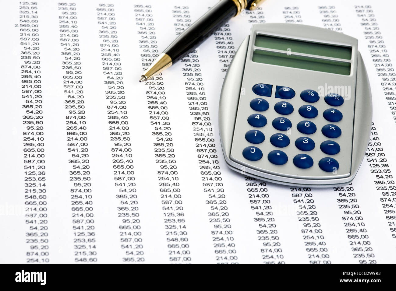 Numerical data with calculator und ball pen - white background Stock ...