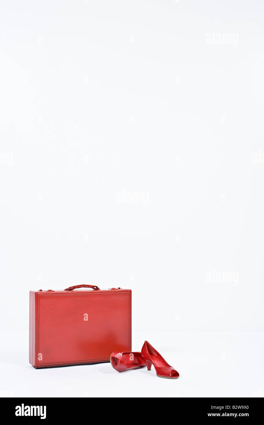 Red high heels and a red briefcase Stock Photo - Alamy