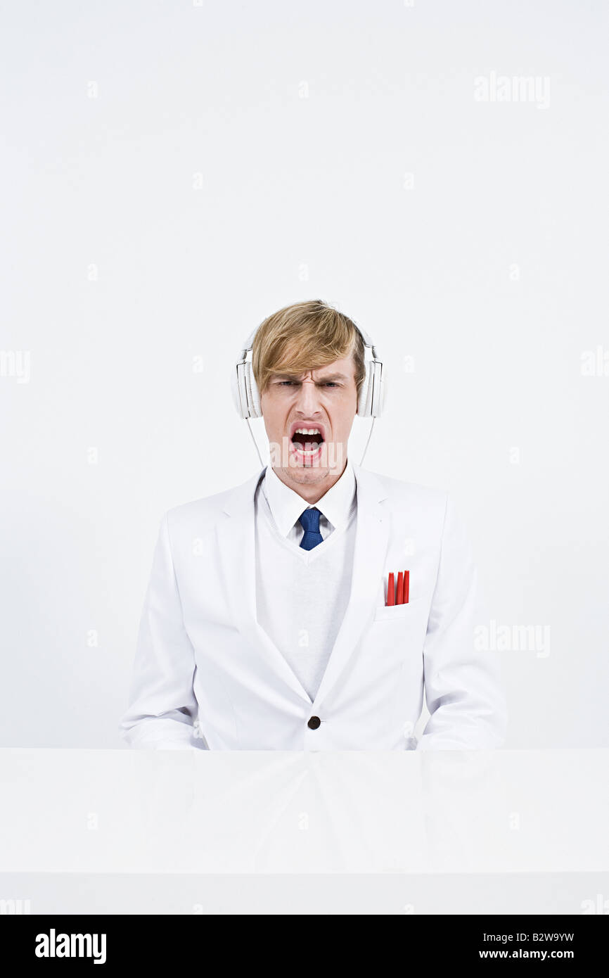A man wearing headphones shouting Stock Photo - Alamy