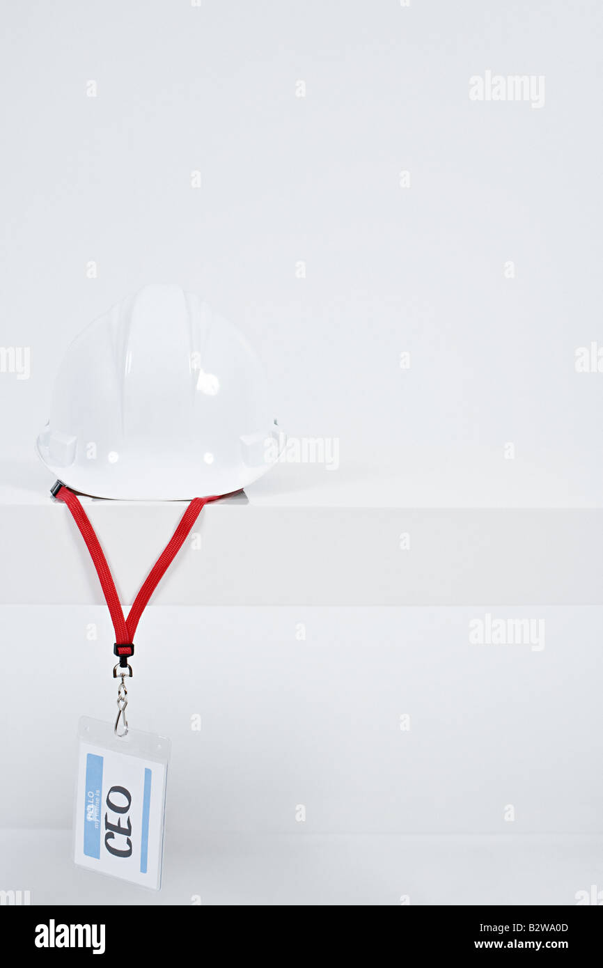 A hard hat and name badge Stock Photo - Alamy