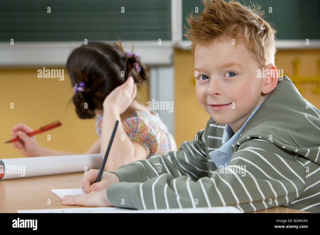 Boy in classroom Stock Photo - Alamy